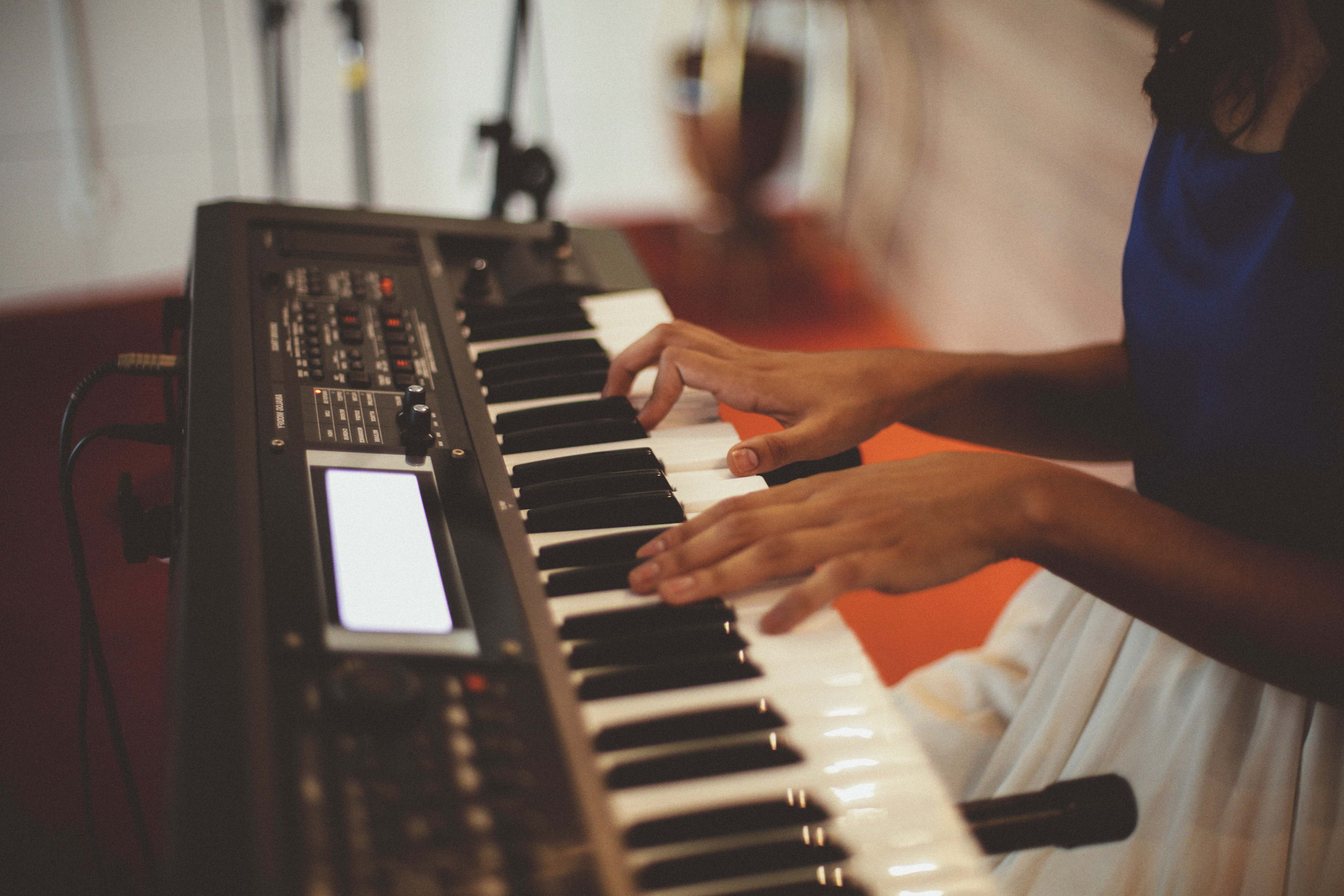 Piano Person Playing A Black Electronic Keyboard Keyboard Image Free Photo