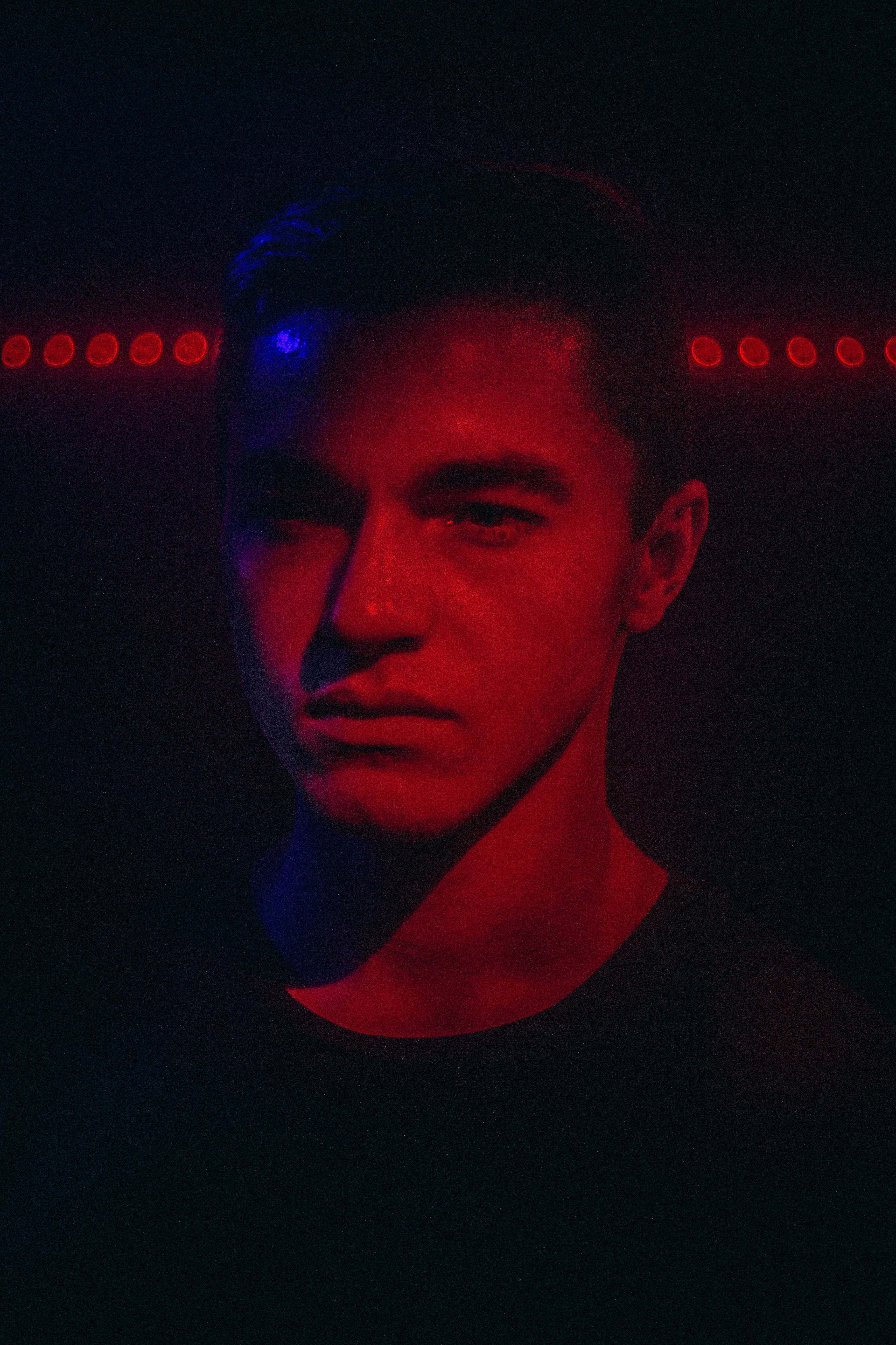 Mysterious Man In Dimly Lit Room With Dazzling Lights Image | Free ...