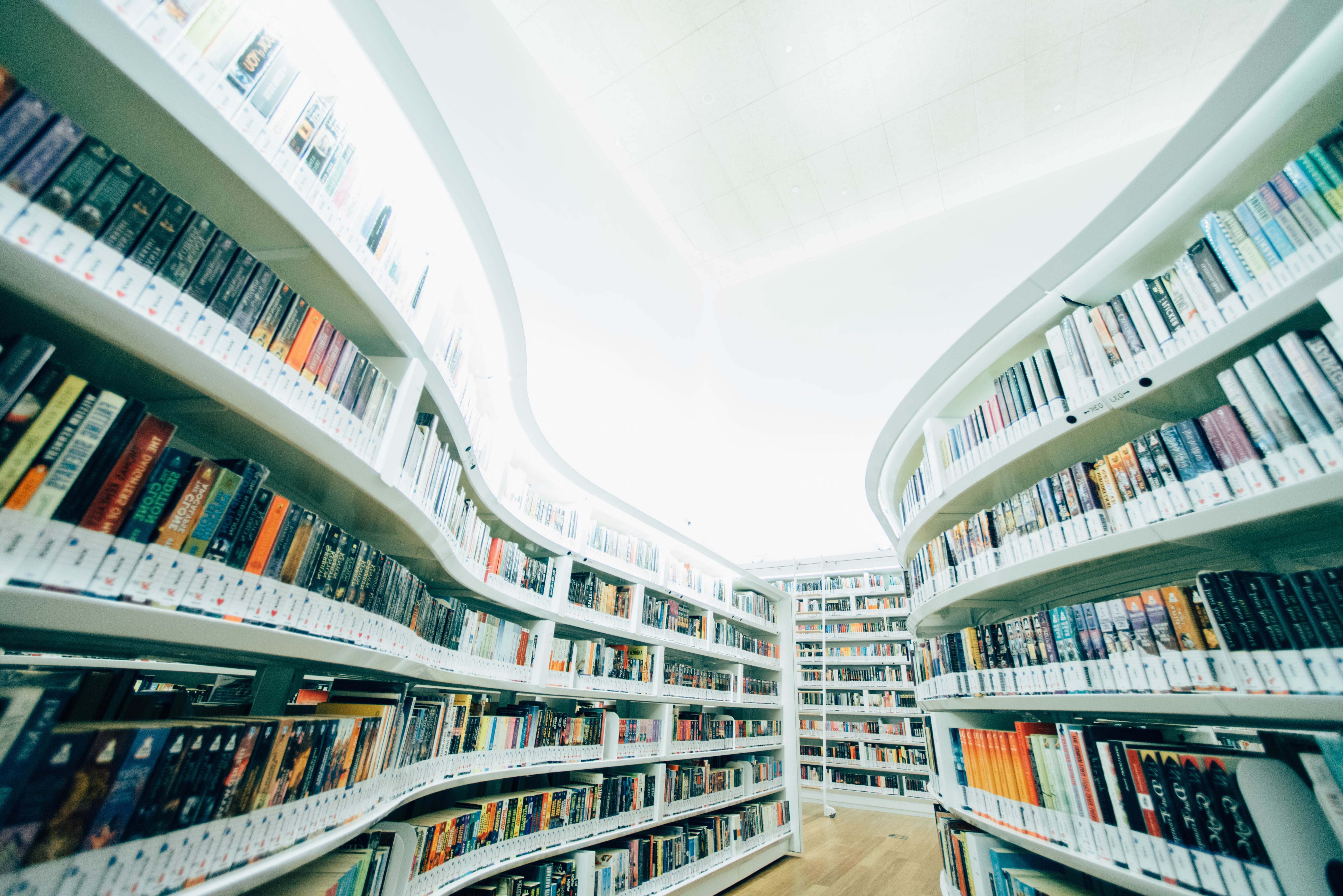 Library Low-angle Photo Of White Bookshelves With Assorted Book Lot ...